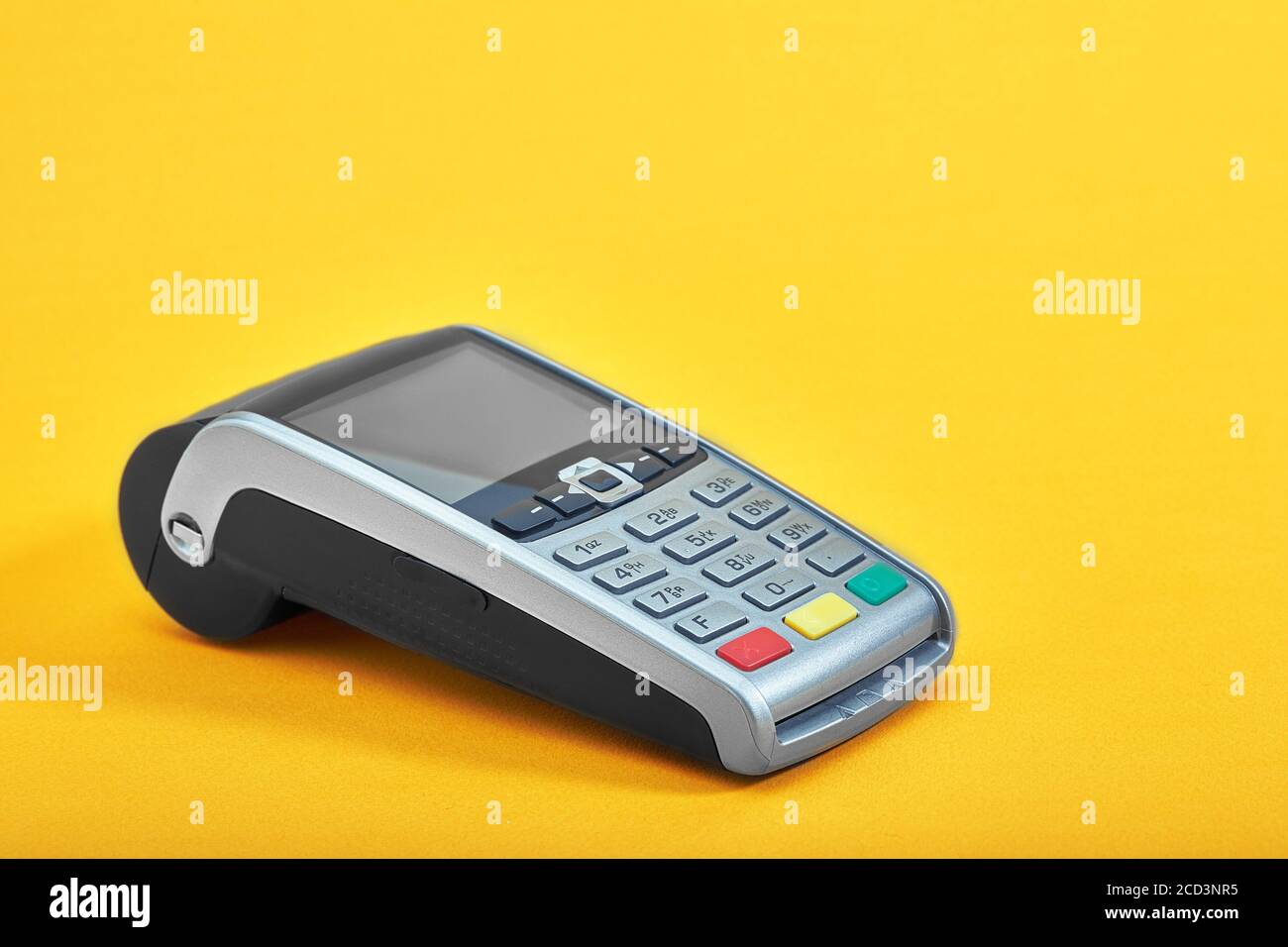 Payment terminal, compact POS terminal on yellow background top view ...