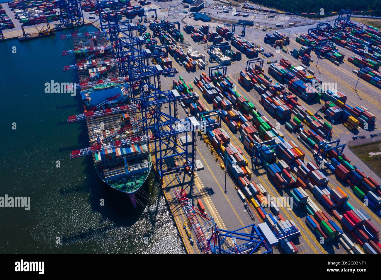 Container ship loading at port with crane, container ship carrying ...