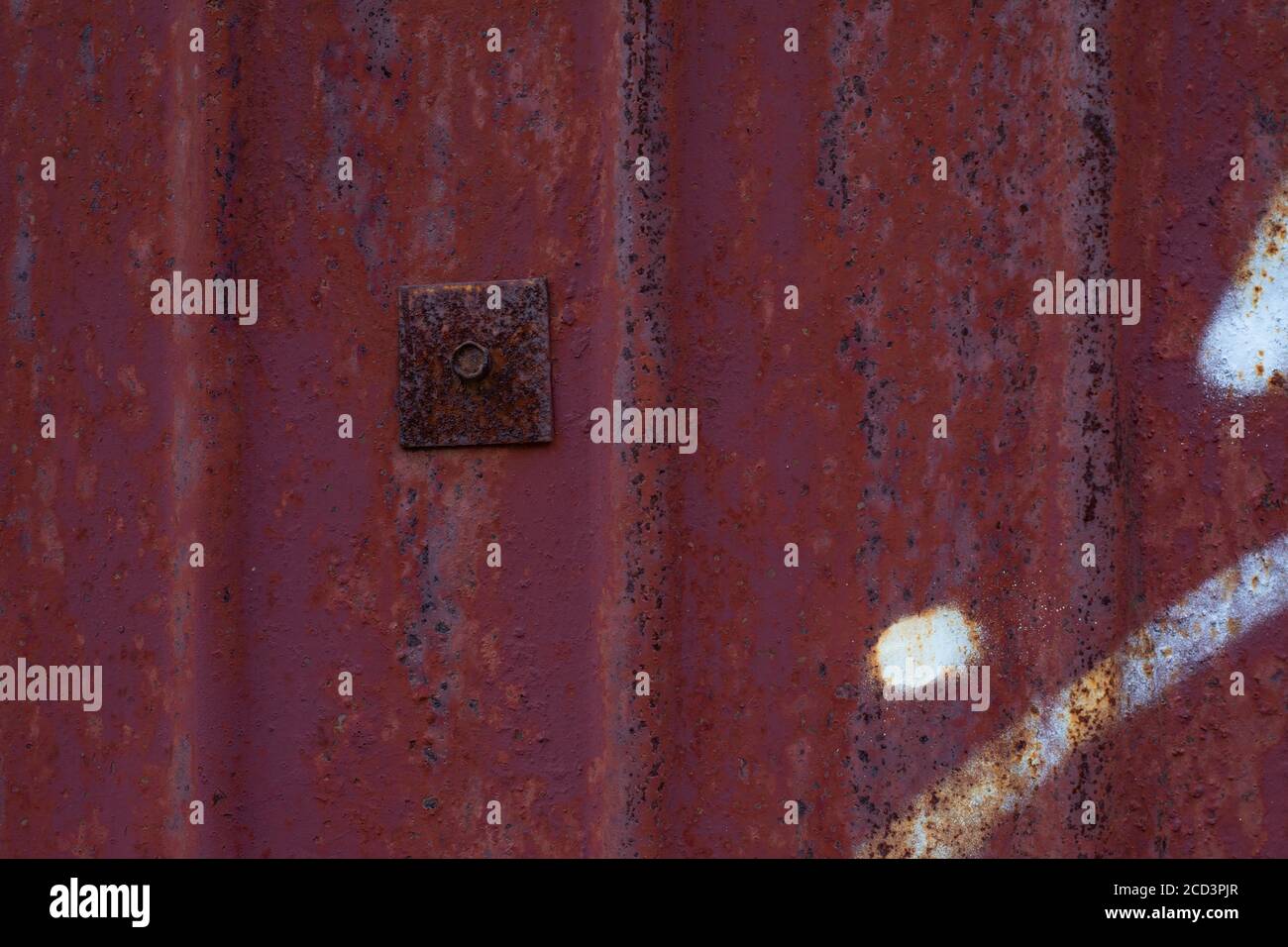 Texture of rusty metal surface with a patch. An old rusty sheet of iron ...