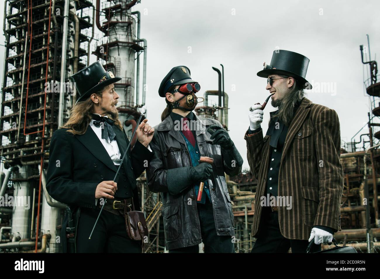 Three mans in steampunk style discuss standing against the industrial ...