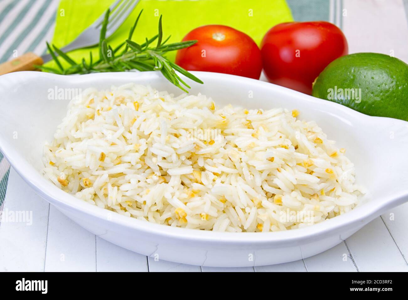 cooked white rice dish on a white background Stock Photo - Alamy