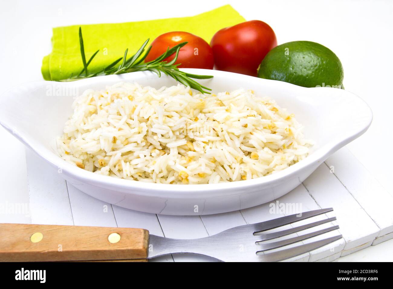 cooked white rice dish on a white background Stock Photo - Alamy