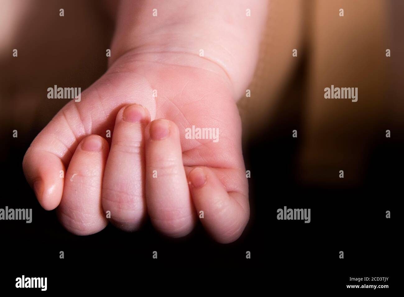 Baby hand hi-res stock photography and images - Alamy