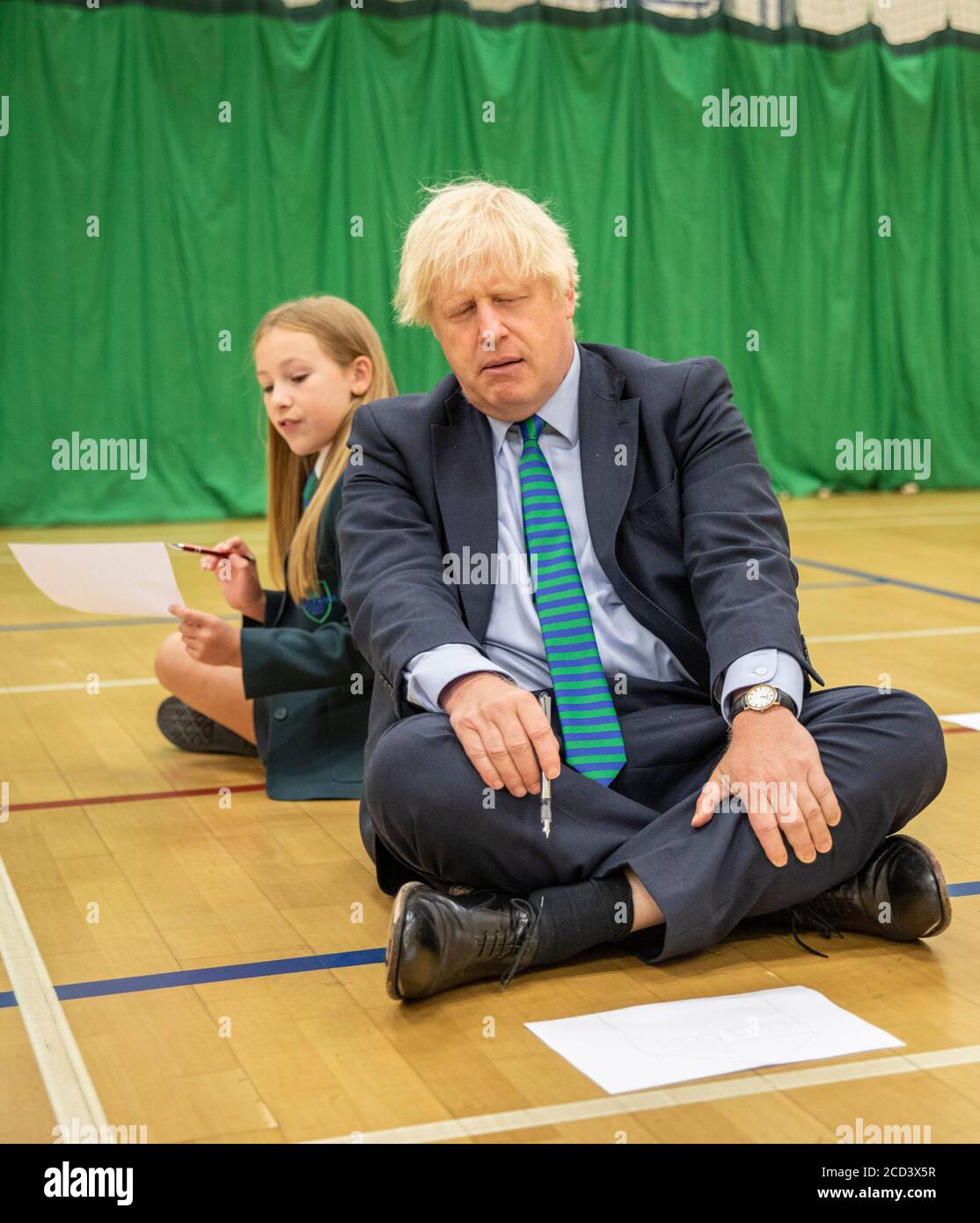Prime Minister Boris Johnson with Olivia Stokes in the gym taking part ...