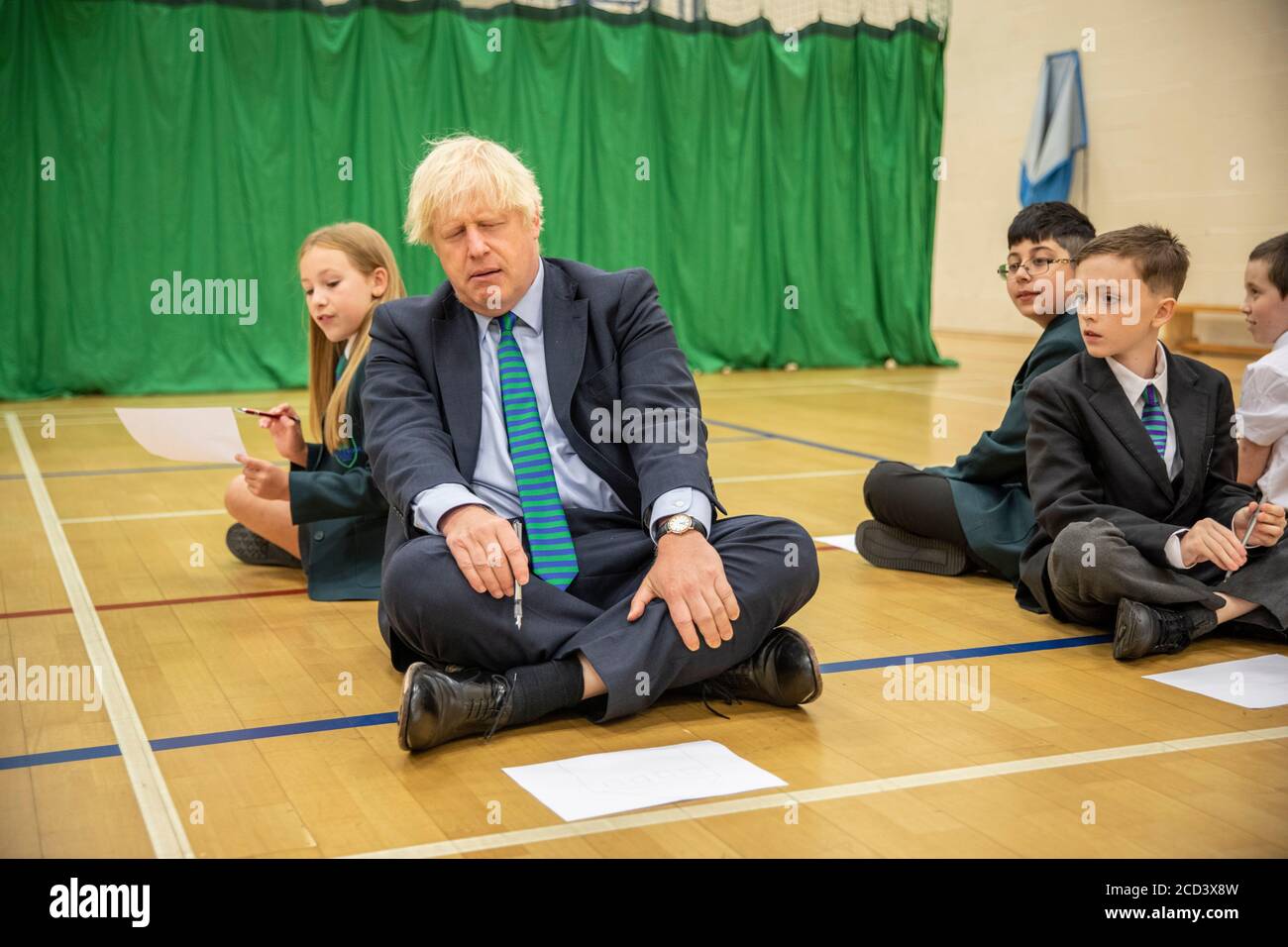 Prime Minister Boris Johnson with Olivia Stokes in the gym taking part ...