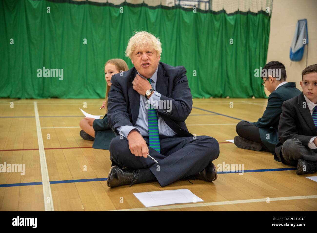 Prime Minister Boris Johnson with Olivia Stokes in the gym taking part ...