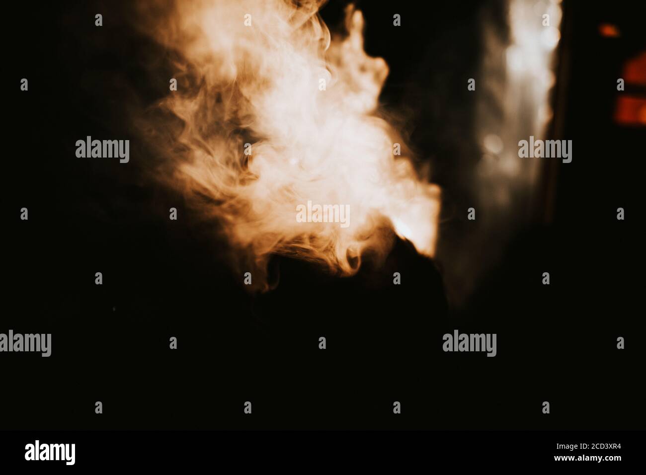 Beautiful dense smoke in a dark room with yellow rays of the sun Stock ...