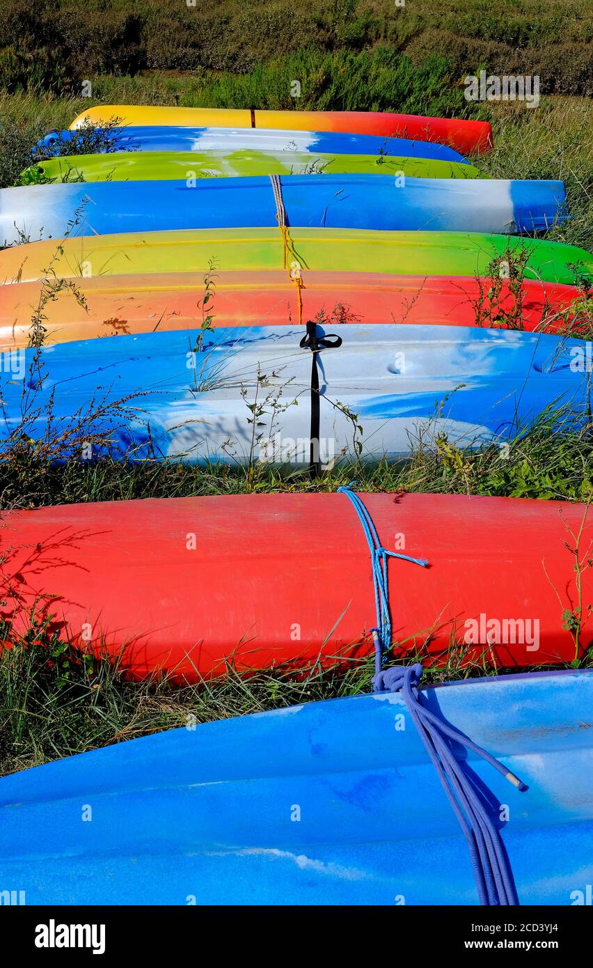 colourful canoes at blakeney, north norfolk, england Stock Photo - Alamy