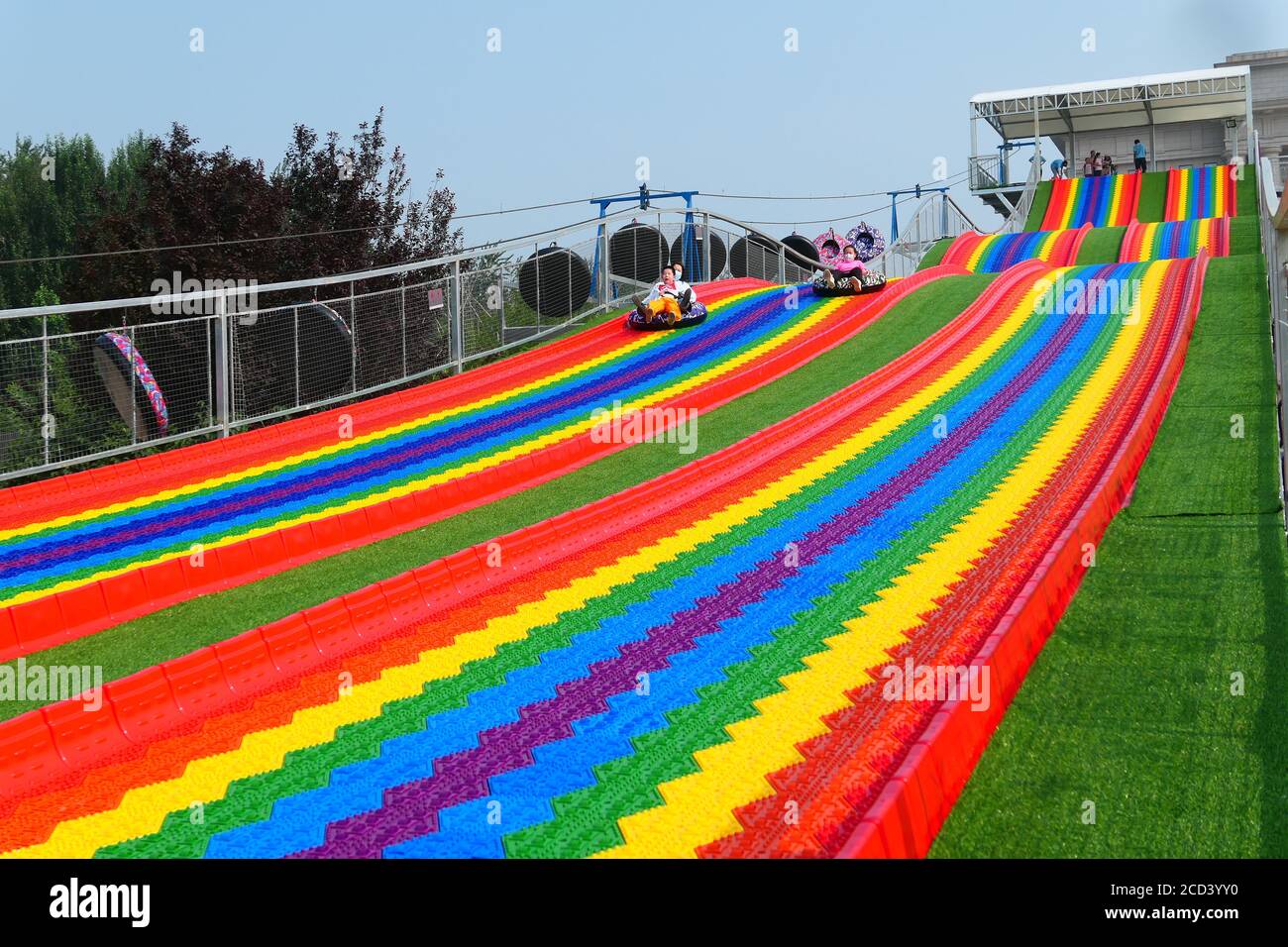People experience the new rainbow slide at the Wukesong Adventure Park ...