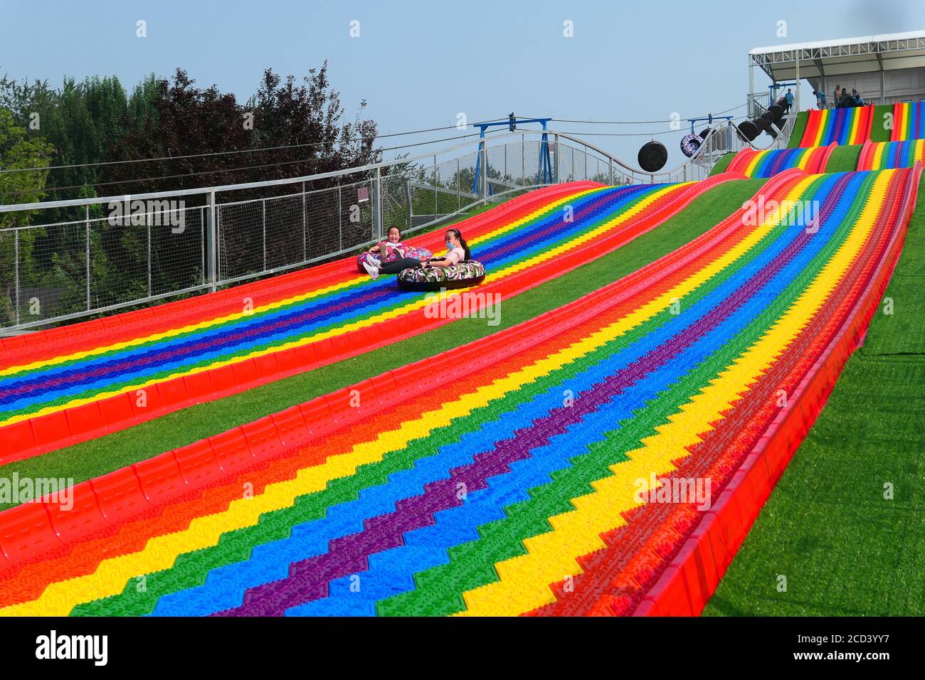 People experience the new rainbow slide at the Wukesong Adventure Park ...