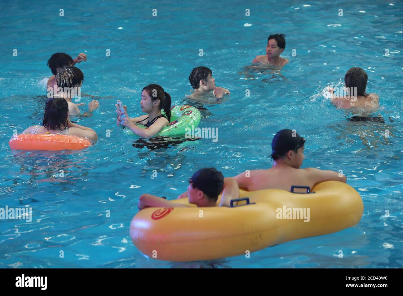 Citizens enjoy water and various aquatic activities to relieve from scorching summer heat as the ...