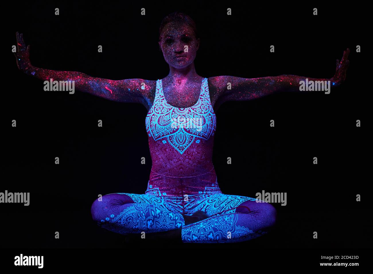 Woman does yoga, hand movement, body warm-up. Art girl cosmos in ...