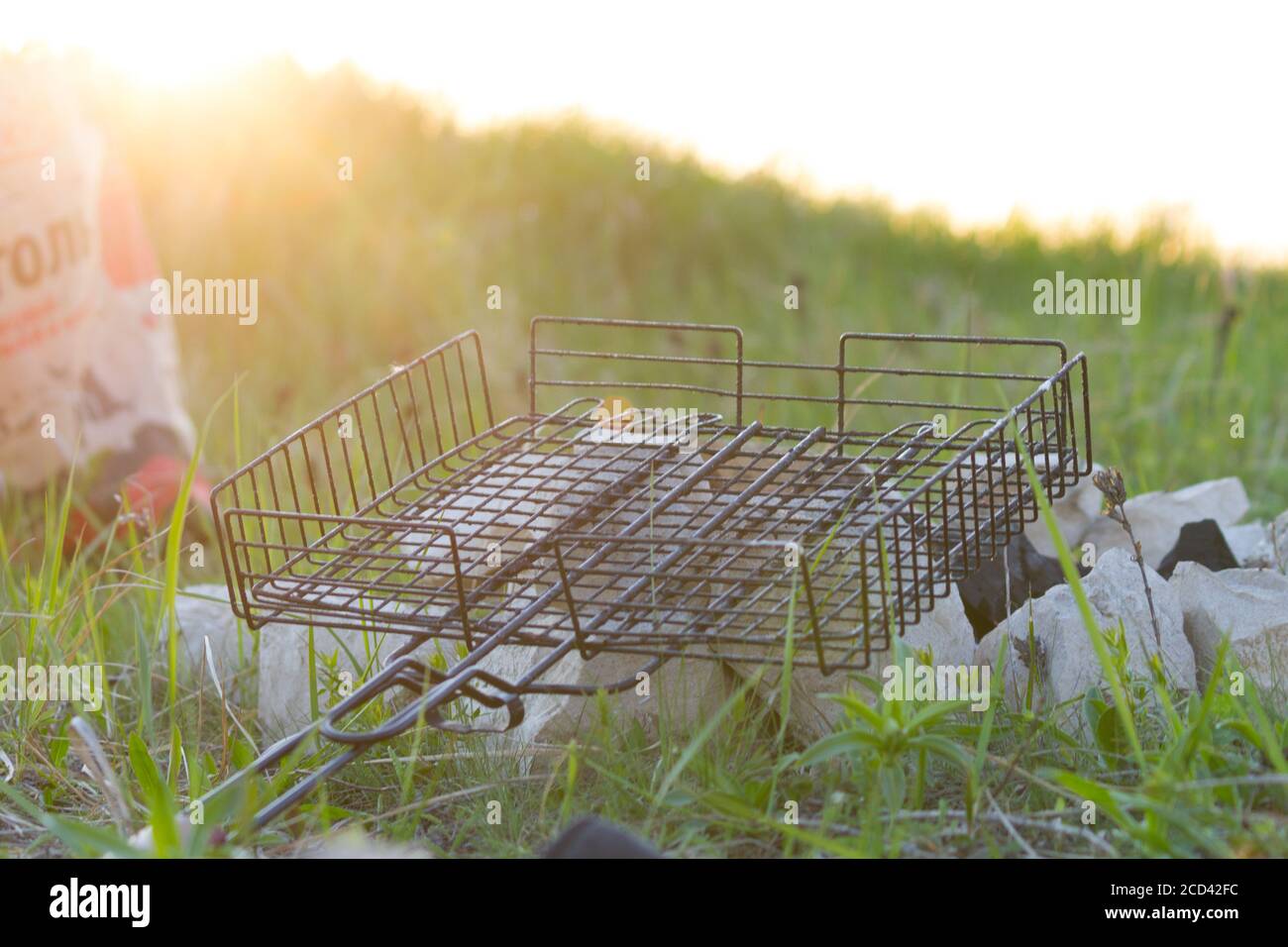 BBQ grid in the grass. Summer Stock Photo - Alamy