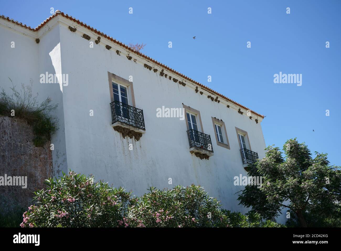 Low angle shot of a white multi-story building Stock Photo - Alamy