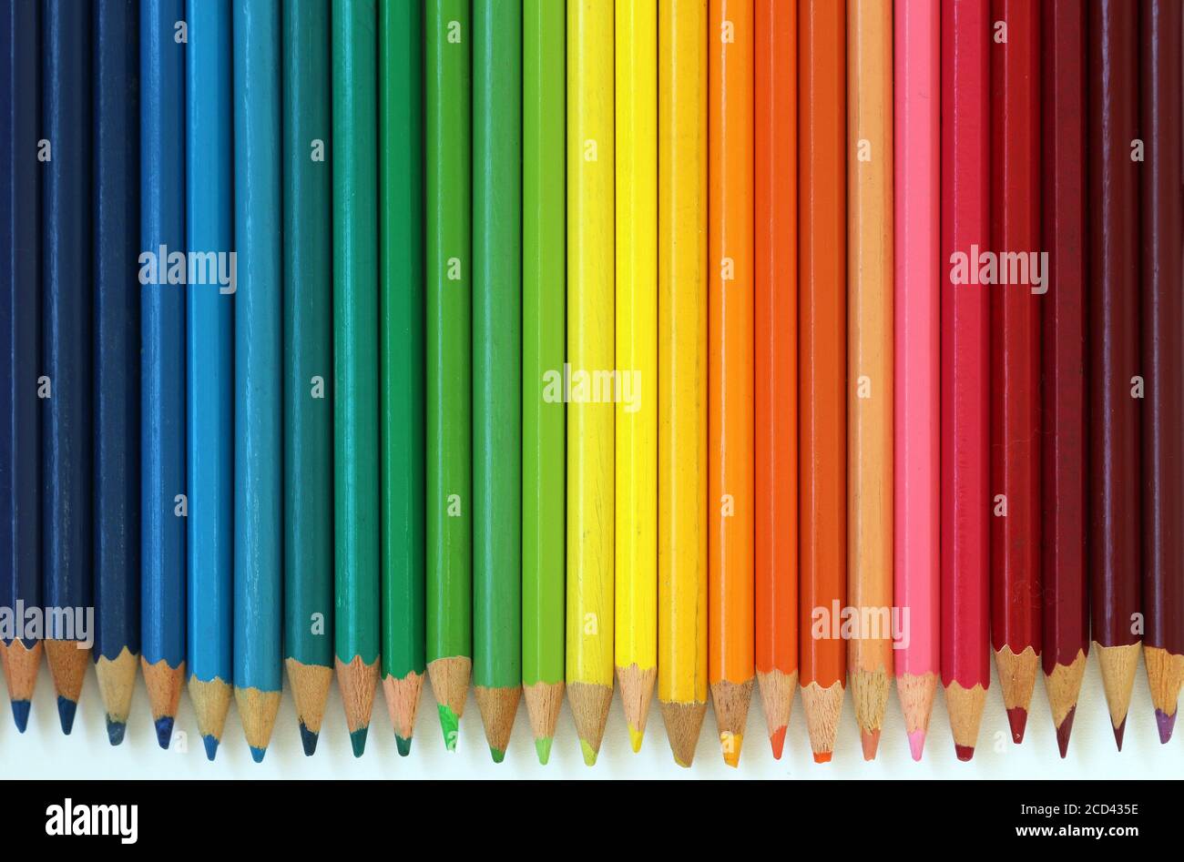 Rainbow of Coloured Pencils in a Row Stock Photo - Alamy