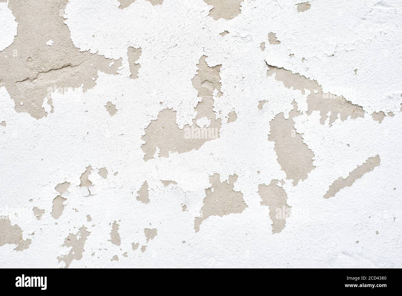 Wall with white peeling plaster. Close up Stock Photo - Alamy