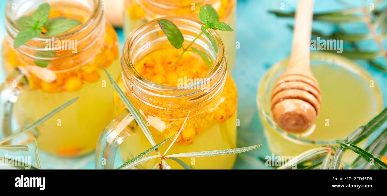 Colorful hot sea buckthorn tea with ginger and honey and sea buckthorn ...