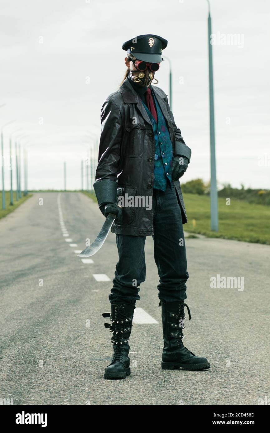 Young man weared in steampunk style posing on the road Stock Photo - Alamy