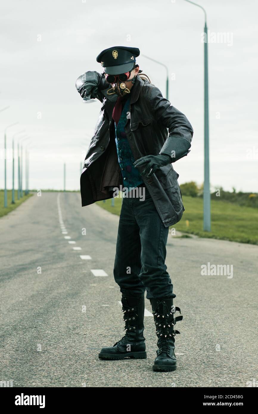 Young man weared in steampunk style posing on the road Stock Photo - Alamy