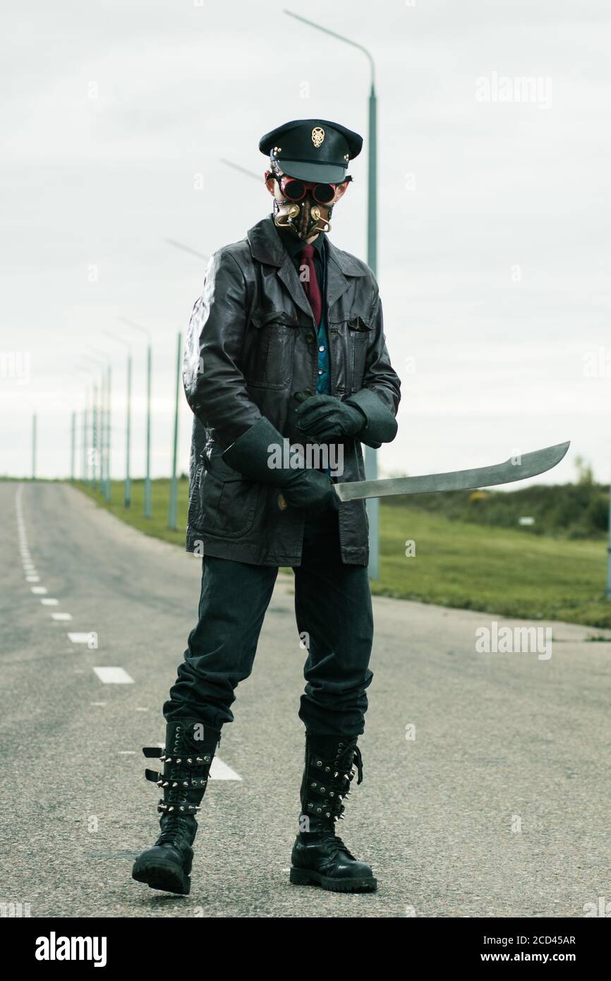 Young man weared in steampunk style posing on the road Stock Photo - Alamy