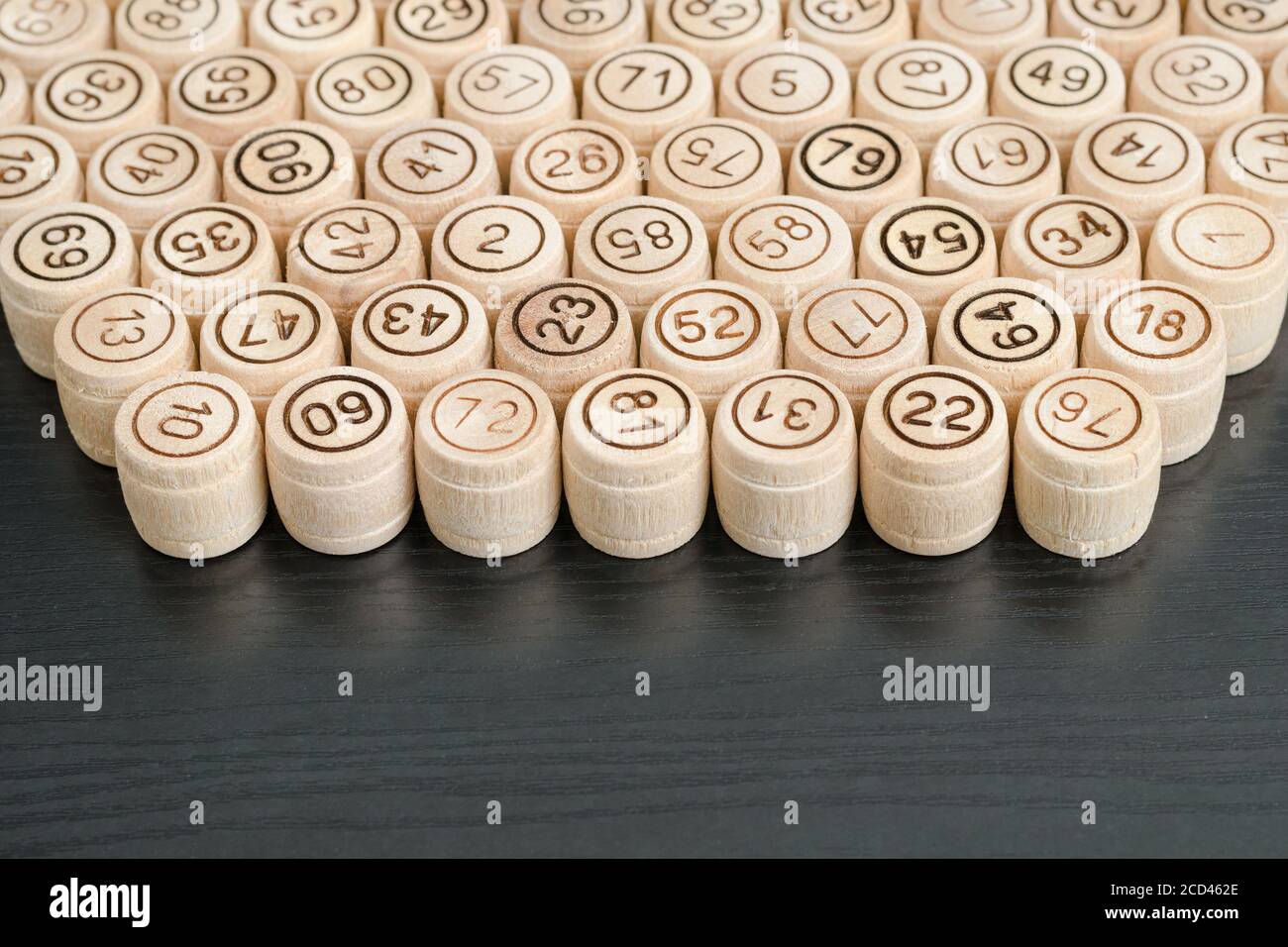 Wooden kegs on a black background. Top view Stock Photo - Alamy