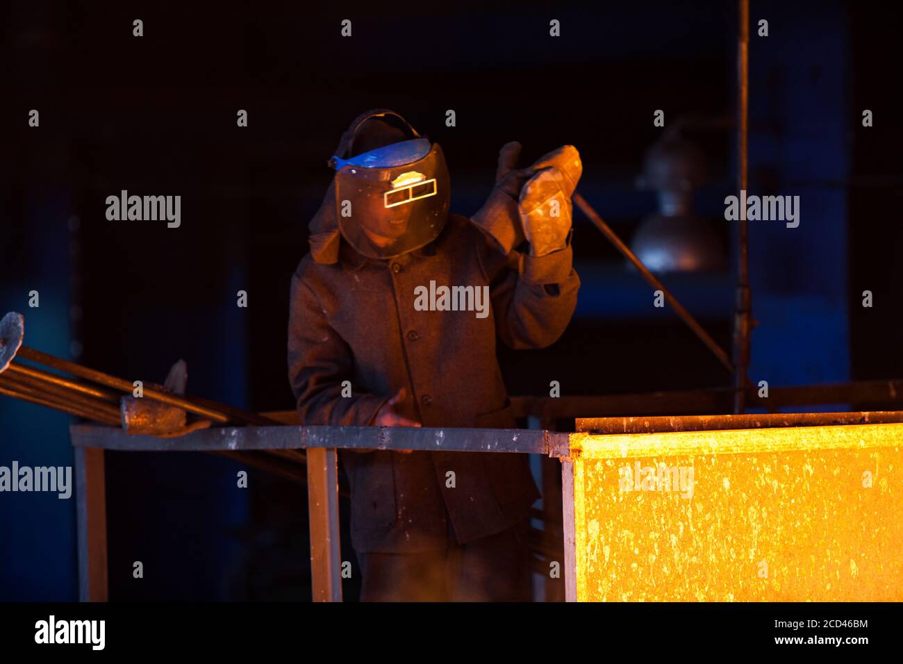 Metallurgy plant factory workshop. Melting of metal. Metallurgist at ...