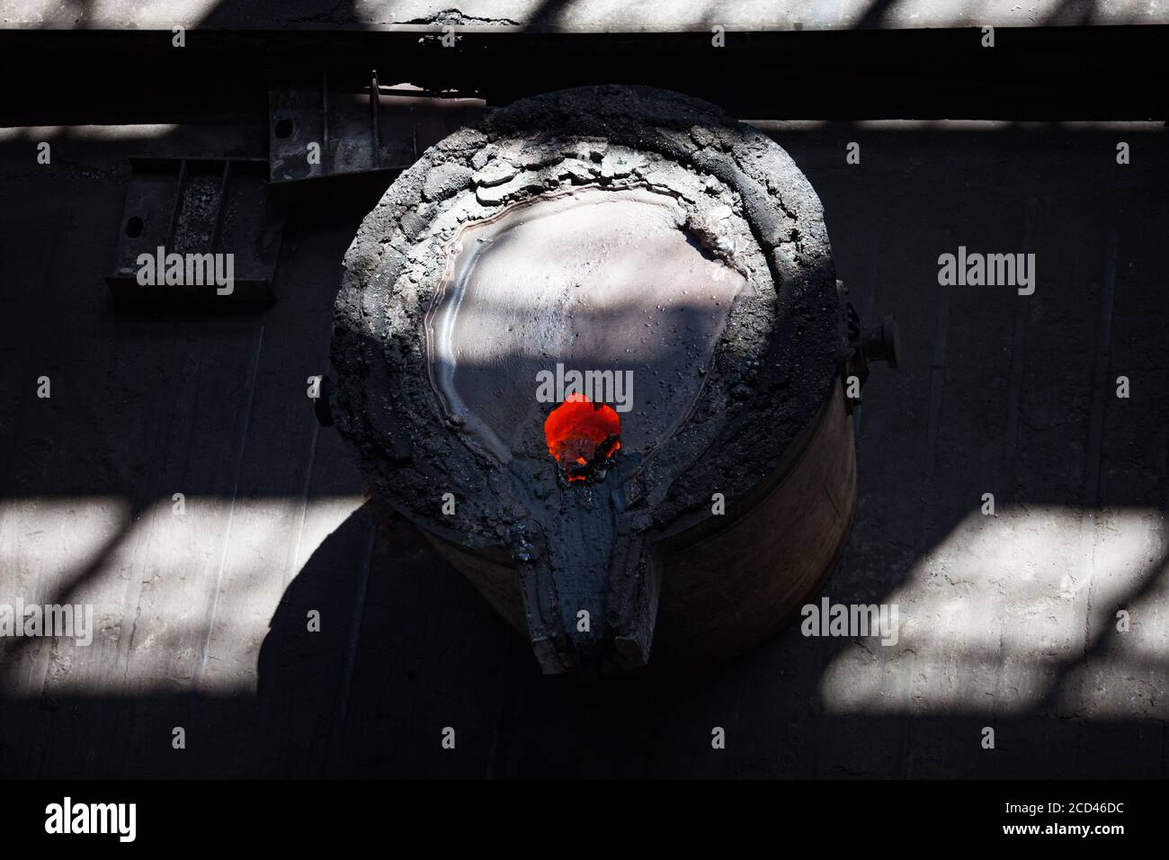 Liquid red hot metal in metallurgy bucket. Metallurgical factory ...