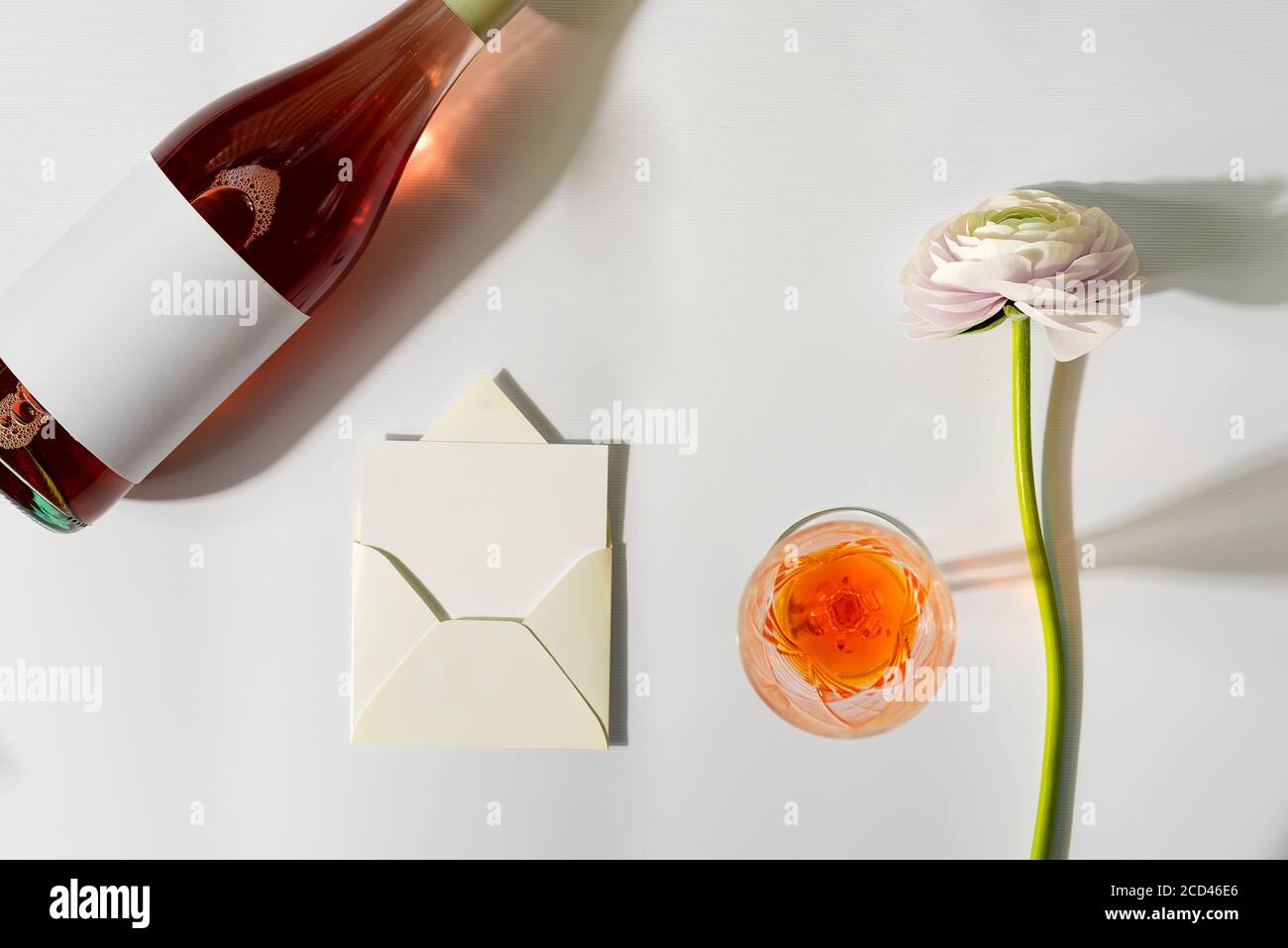 Congratulation postcard with bottle of rose wine, tender natural flower ...