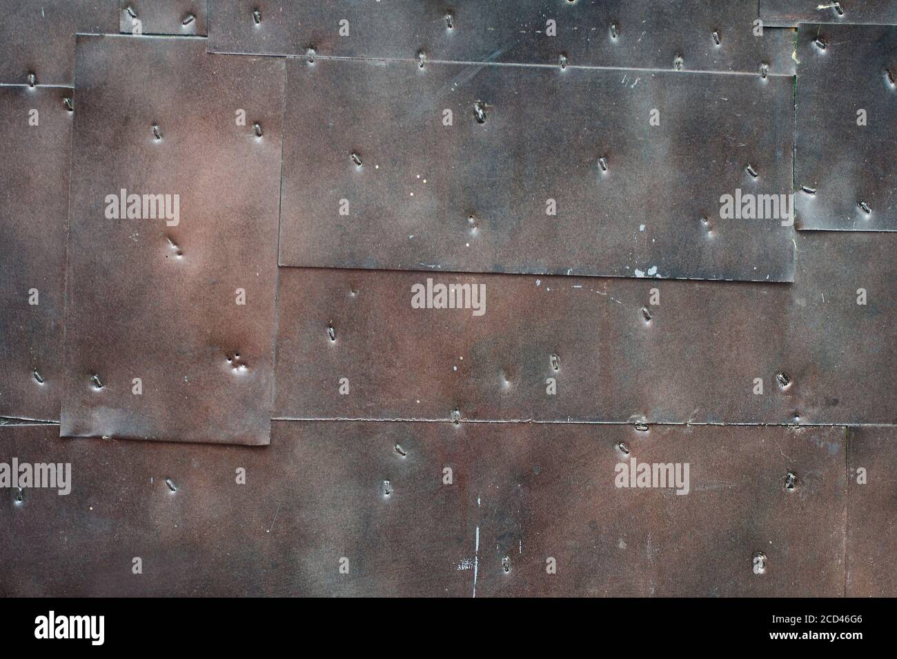 Armored wall of metal plates. Background Stock Photo - Alamy