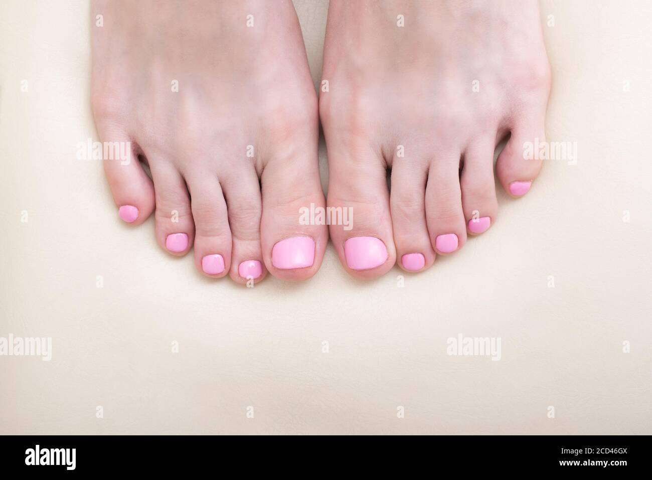 Women's toes close up. Pink pedicure. White background Stock Photo - Alamy