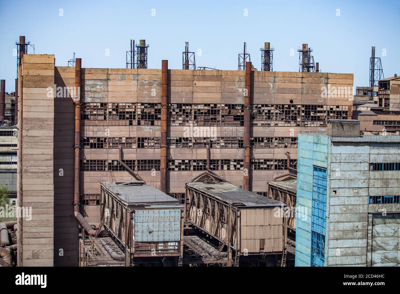 Old abandoned soviet metallurgy factory buildings with broken windows ...