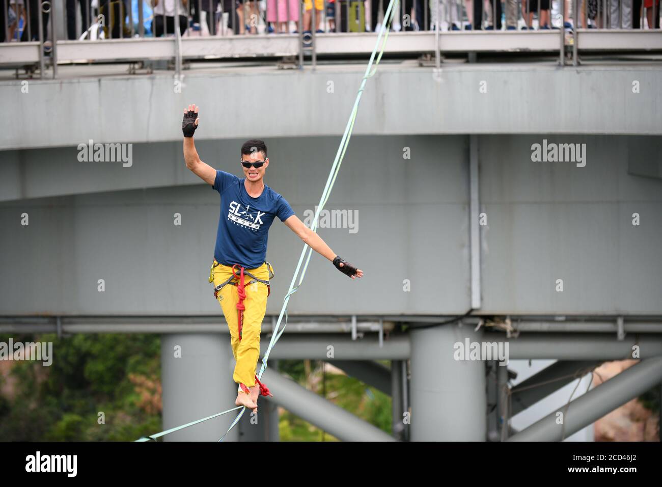 Shi Hailin, who is praised as the best slackliner in Asia, performs ...