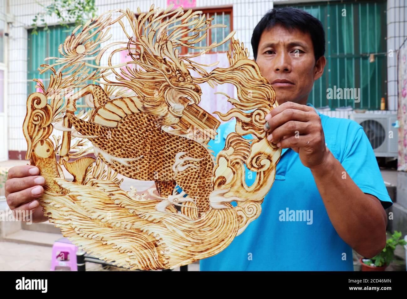 Artist and farmer Guo Shunling shows his art at Junying village ...