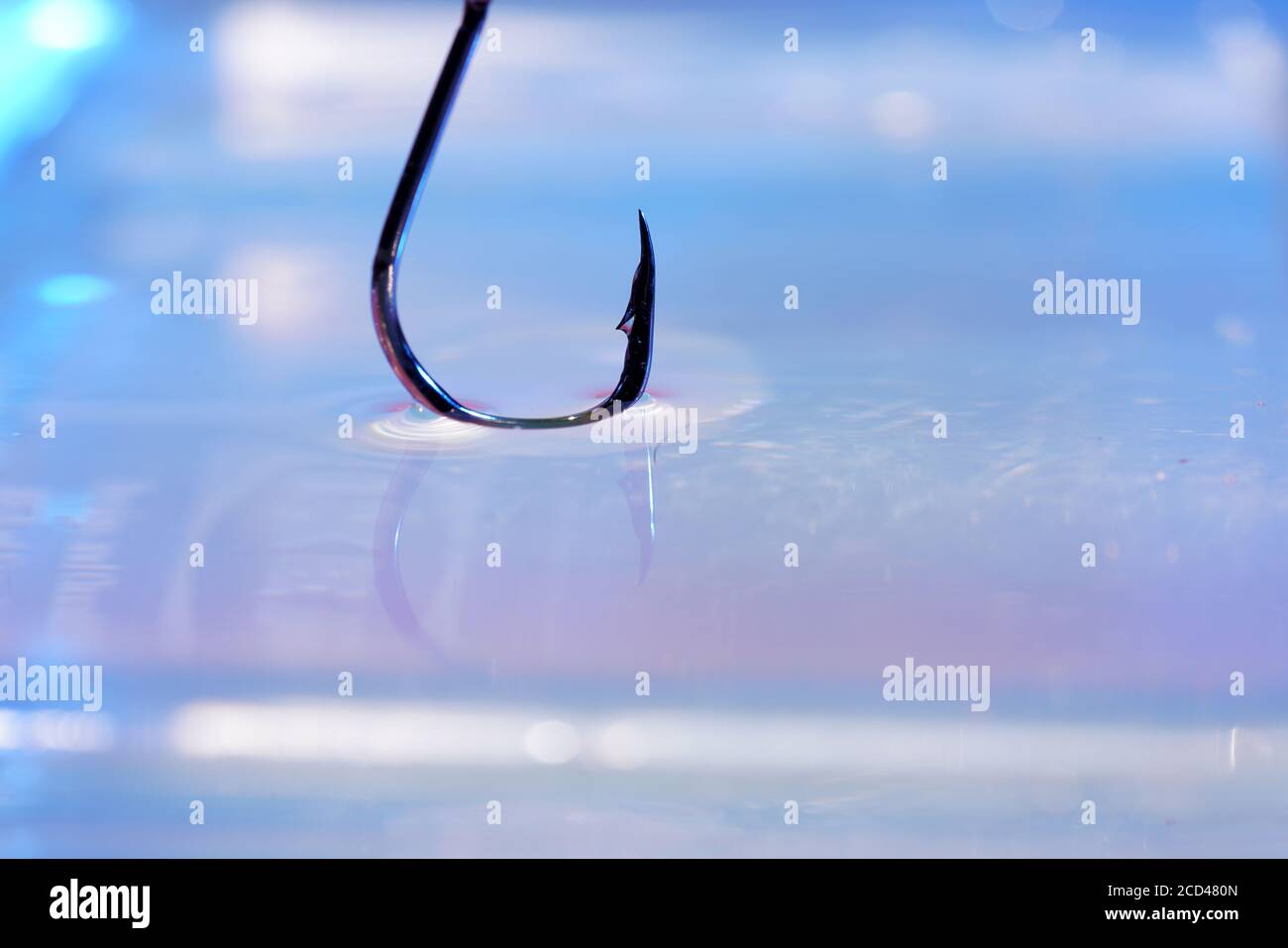 Closeup shot of a metal sharp hook on a water surface Stock Photo - Alamy