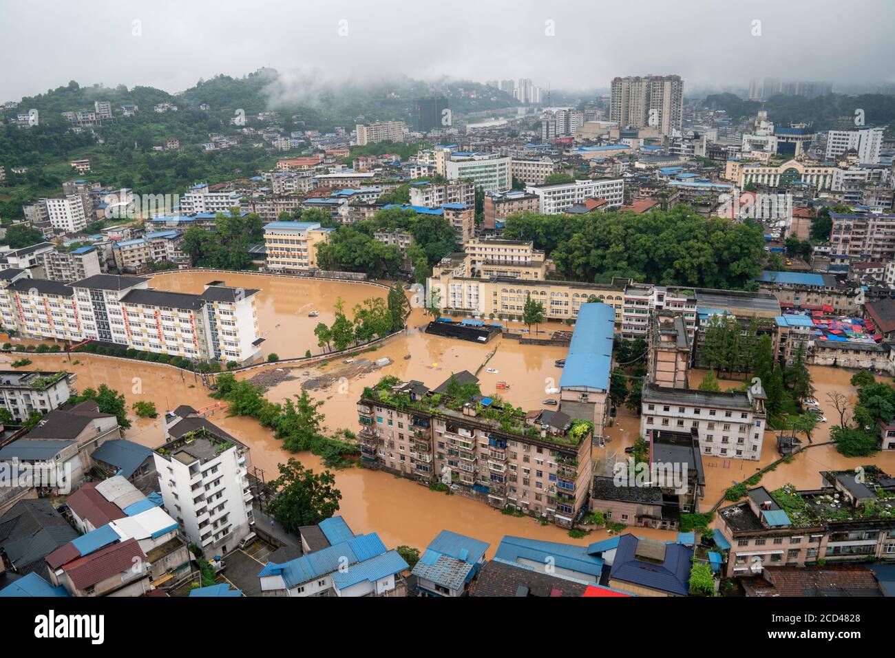 An aerial view of department buildings submerged by flood in Enshi ...