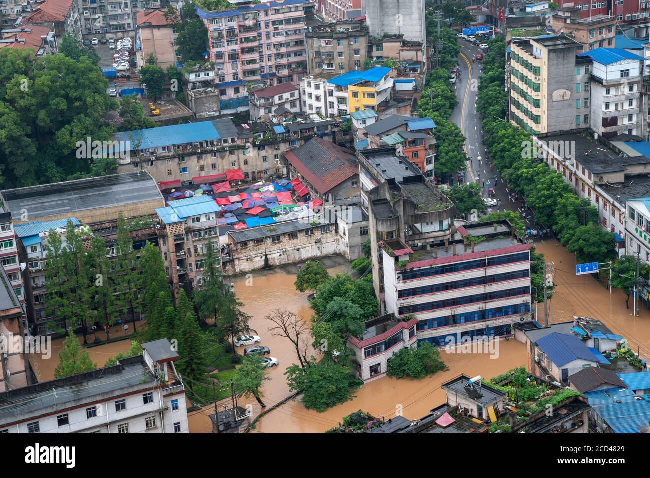 An aerial view of department buildings submerged by flood in Enshi ...