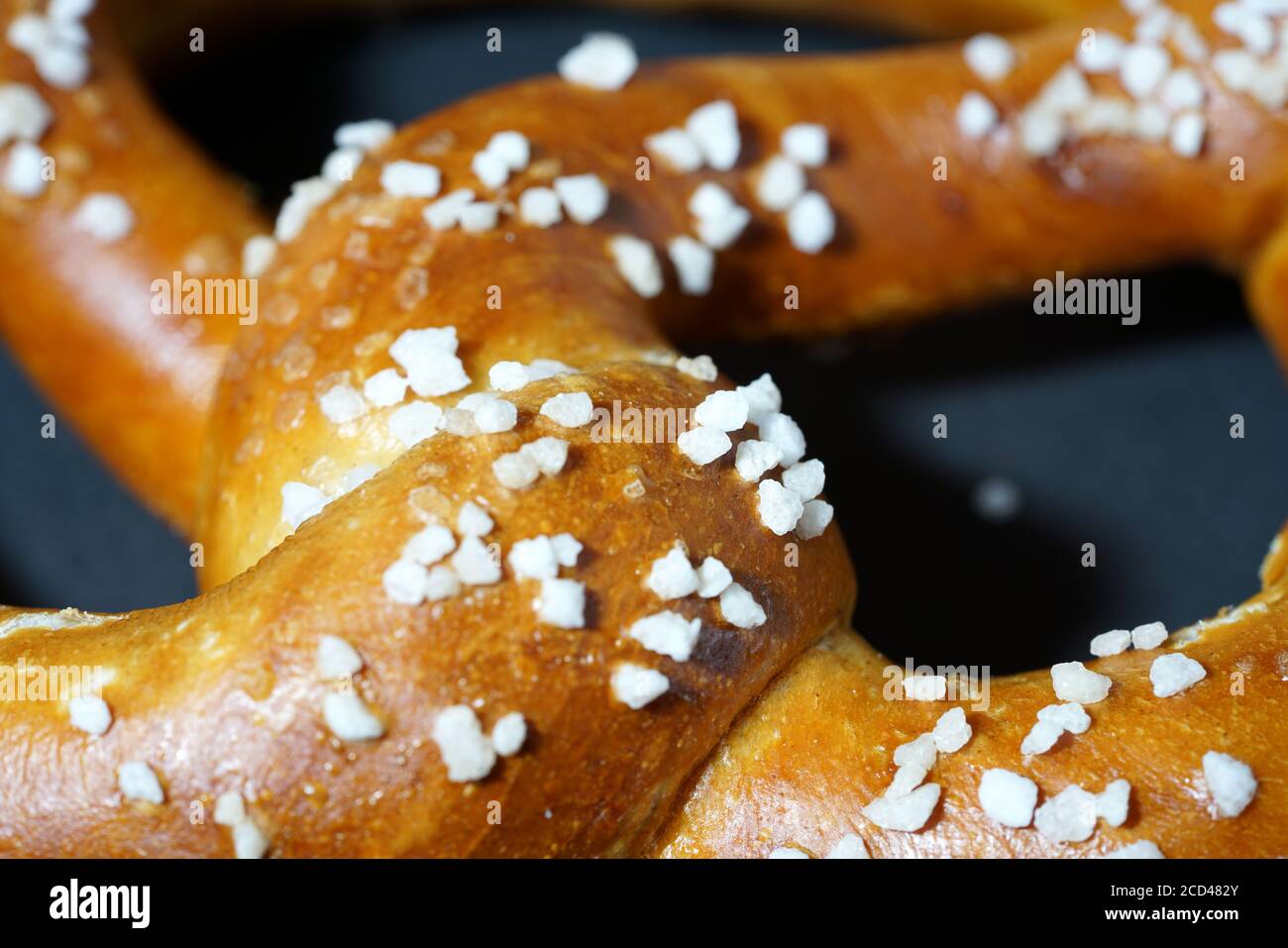 Closeup of a delicious soft pretzel on the table under the lights Stock ...
