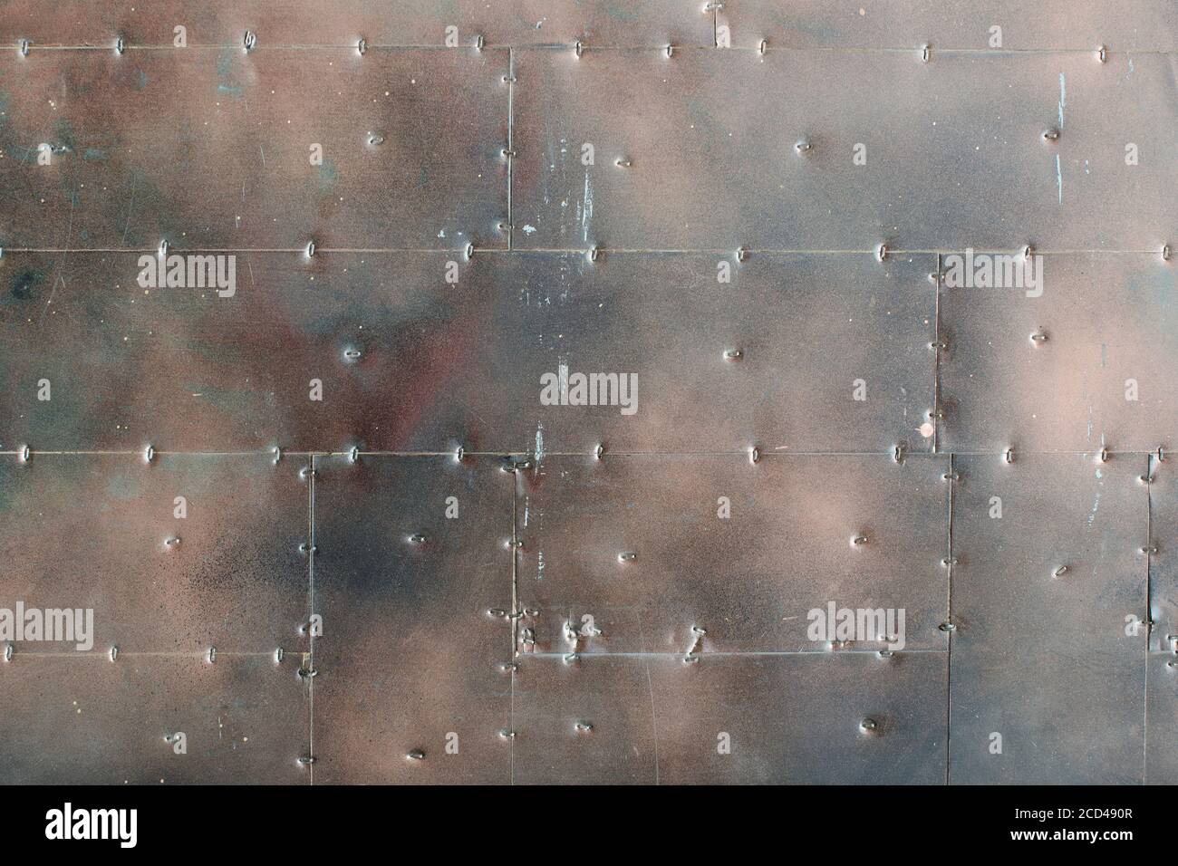 Armored wall of metal plates. Background Stock Photo - Alamy