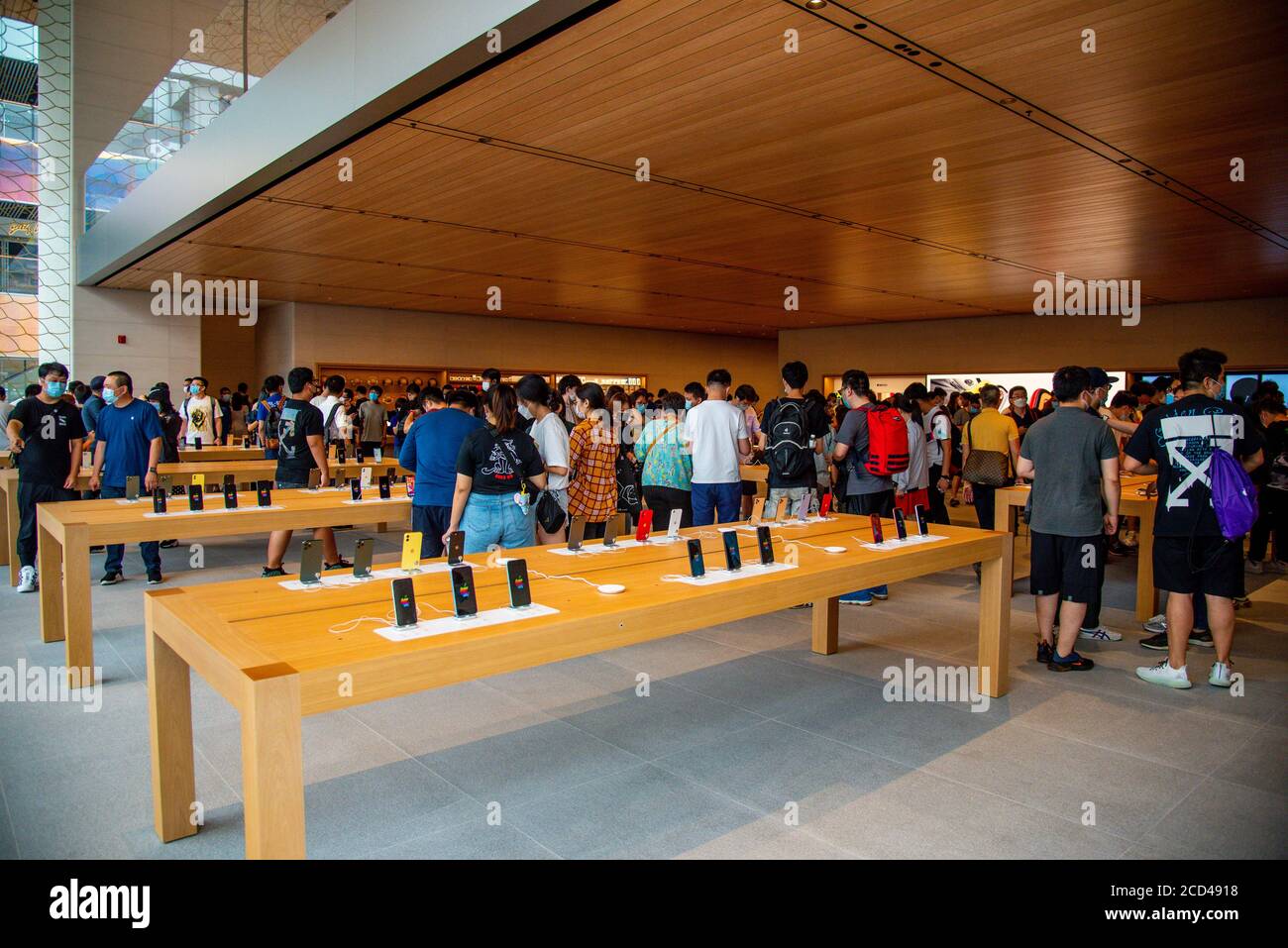People experience Apple products at the newly-opened Apple Store at ...