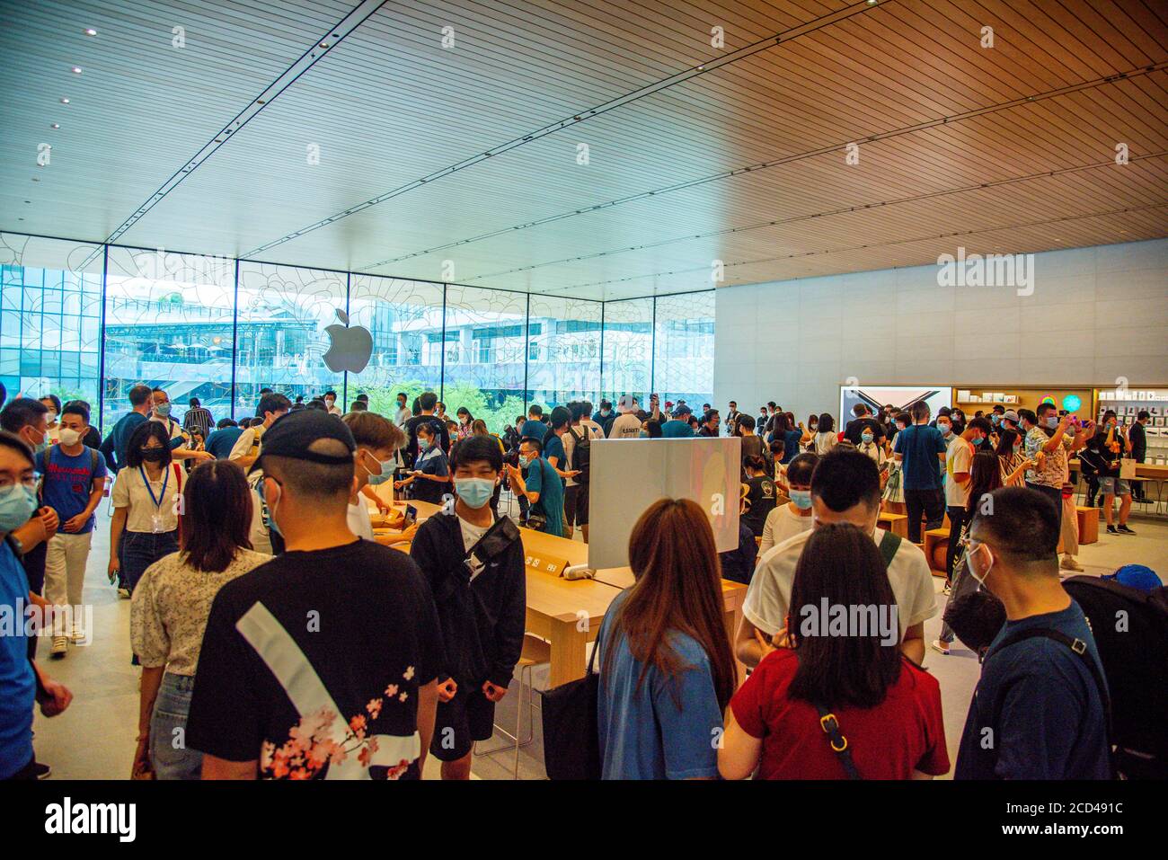 People experience Apple products at the newly-opened Apple Store at ...