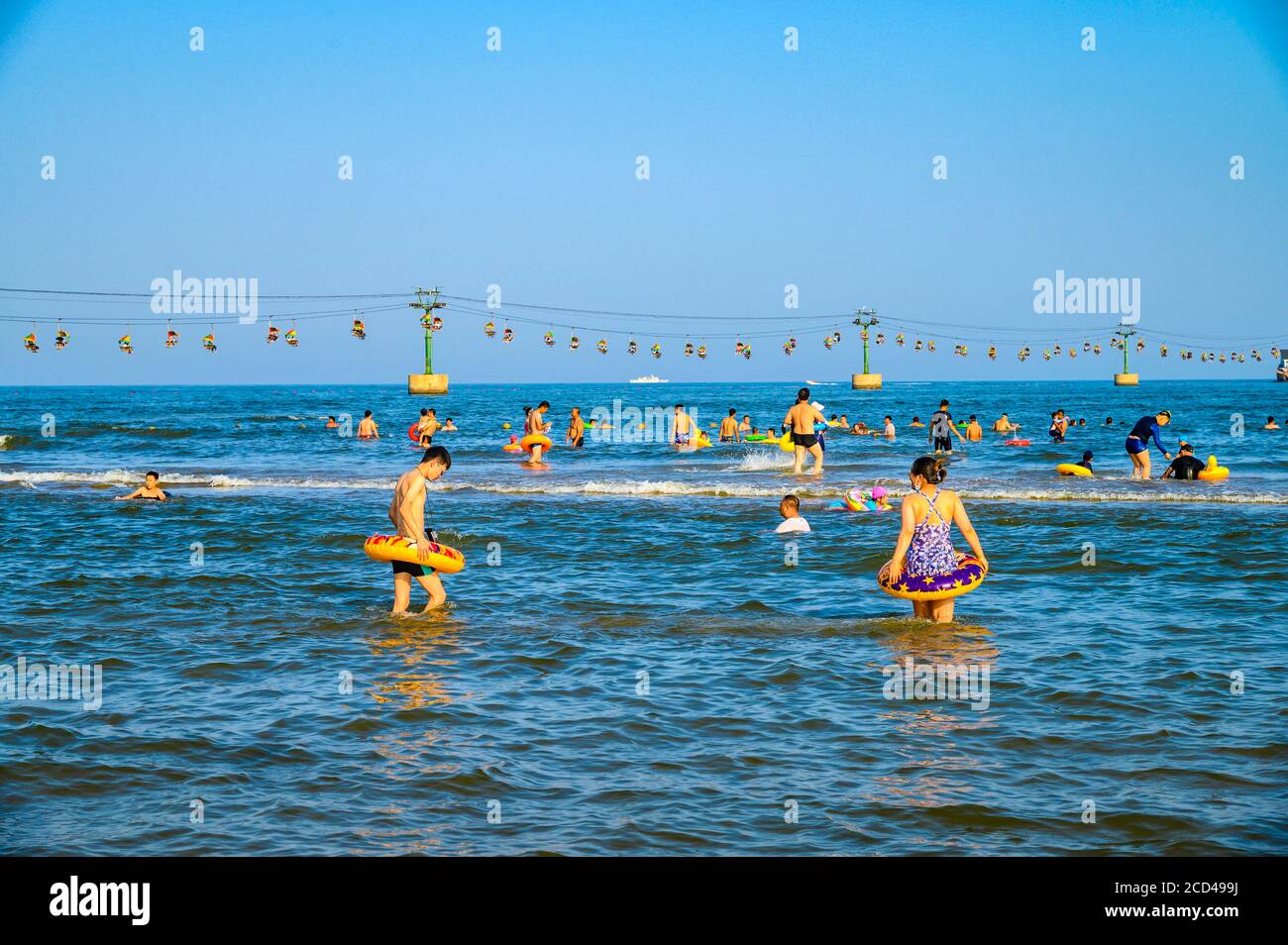 People enjoy the view of Beidai River as people flock to Beidaihe ...