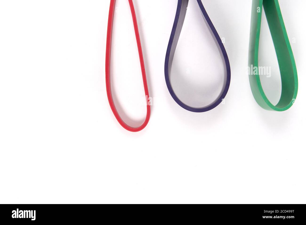 Closeup of colorful resistance bands isolated on a white background ...