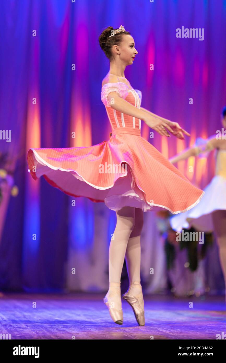 Trio of young girls ballerinas and a young man dancing ballet ...