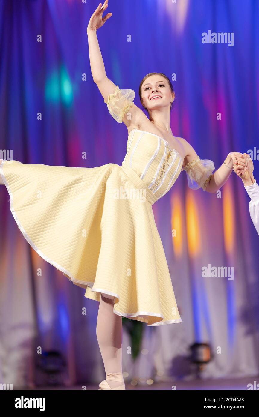 Trio of young girls ballerinas and a young man dancing ballet ...