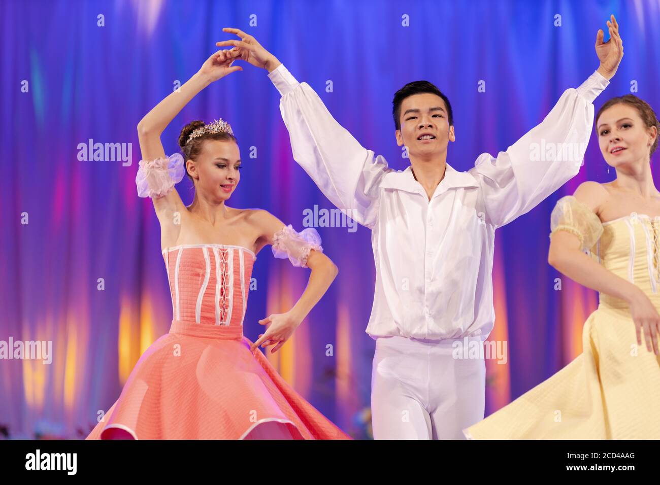 Trio of young girls ballerinas and a young man dancing ballet ...