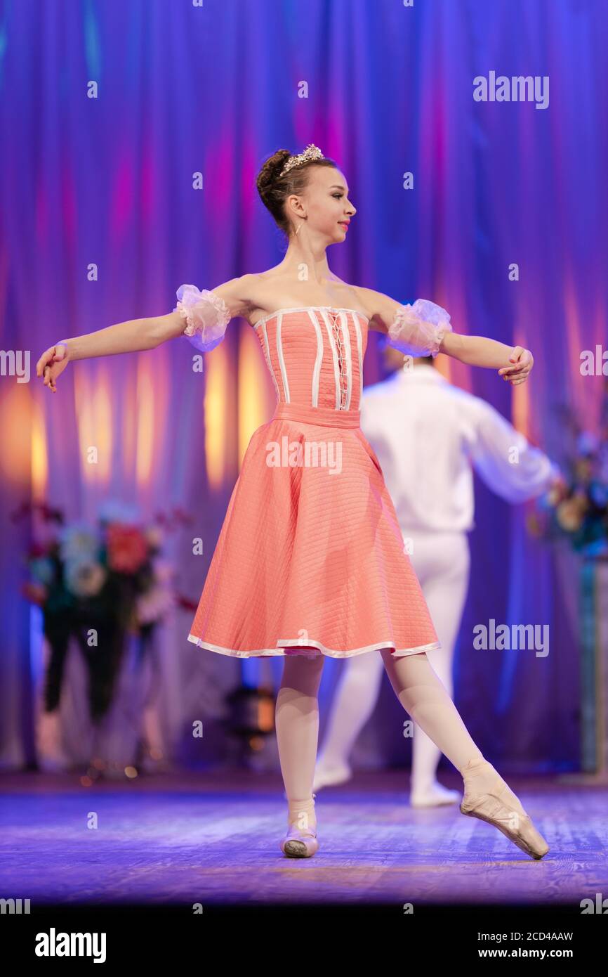 Trio of young girls ballerinas and a young man dancing ballet ...