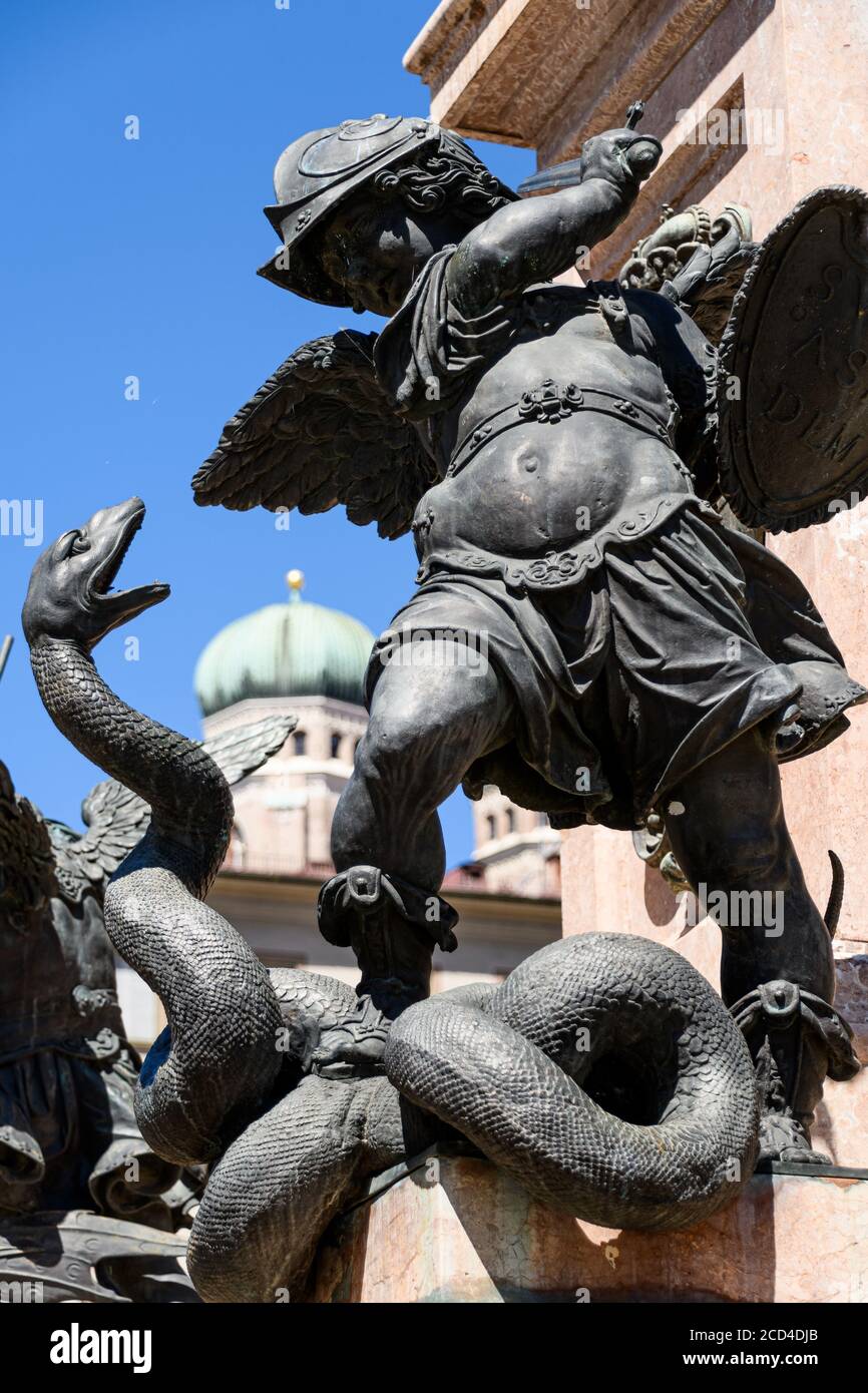 Munich, Germany: Sculpture at the base of the column on Marienplatz ...