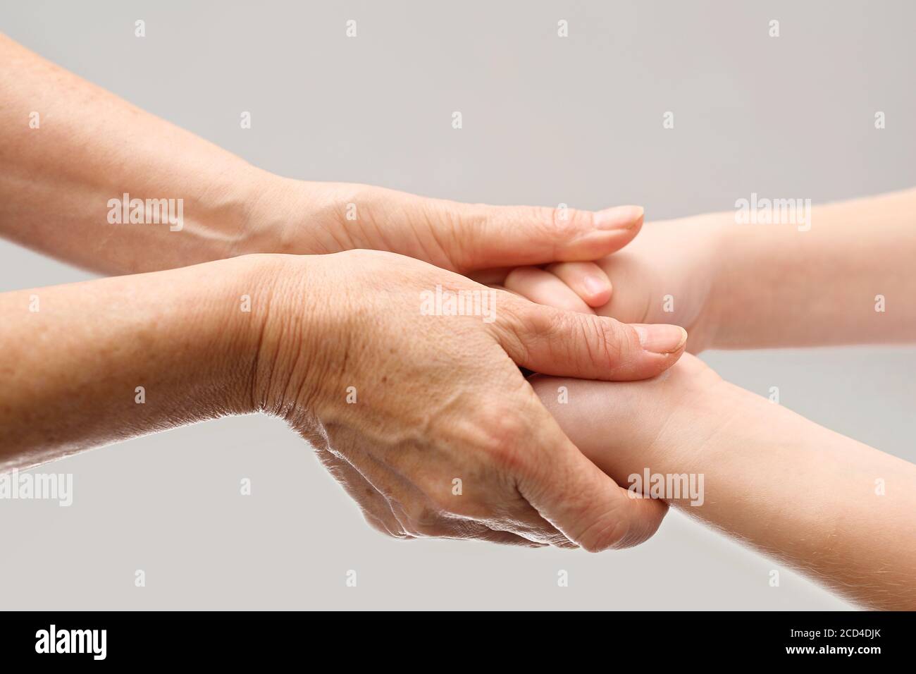 Caring for an elderly person. A helping hand. The old and young hands ...