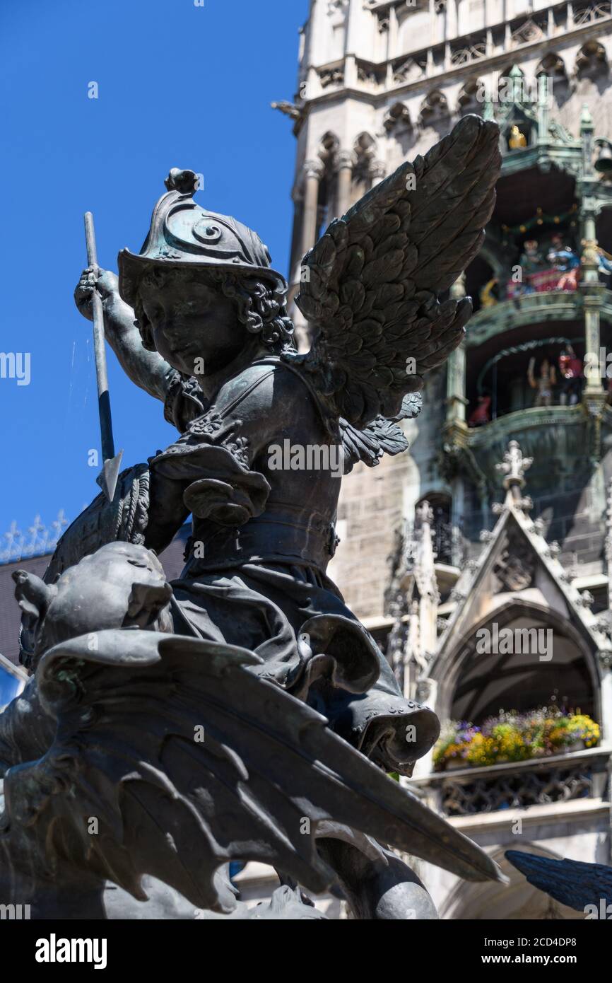 Munich, Germany: Sculpture at the base of the column on Marienplatz ...
