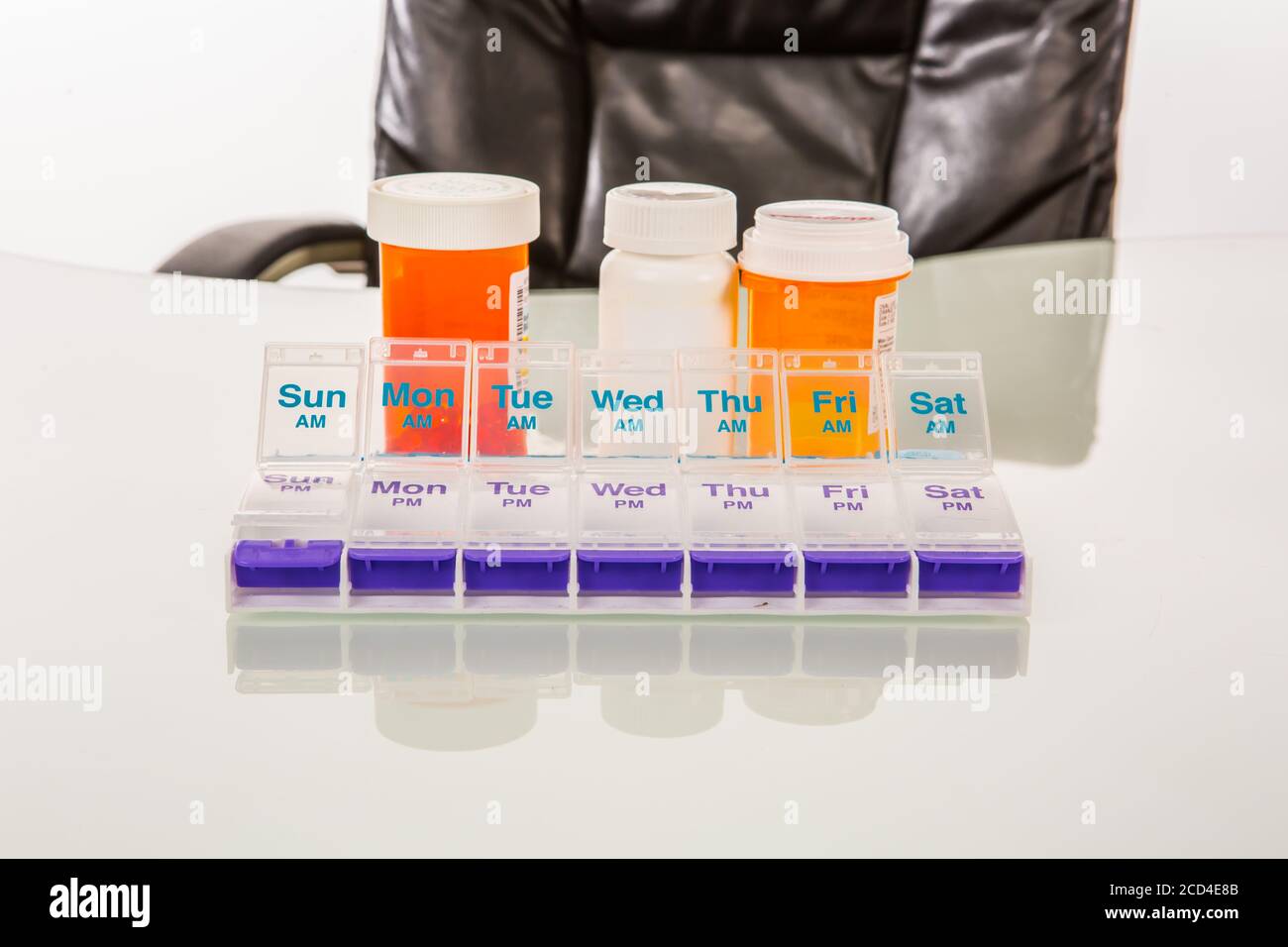 Weekly Pill Box With AM/PM Compartments Stock Photo - Alamy